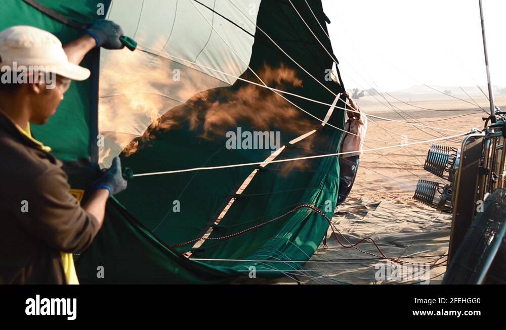 Inflating Hot Air Balloon - Two Crew Members Holding The Mouth Of ...