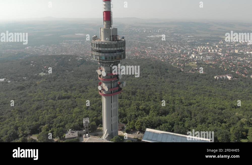 Aerial orbit footage of the Pécs TV Tower. Pécs is the fifth largest ...