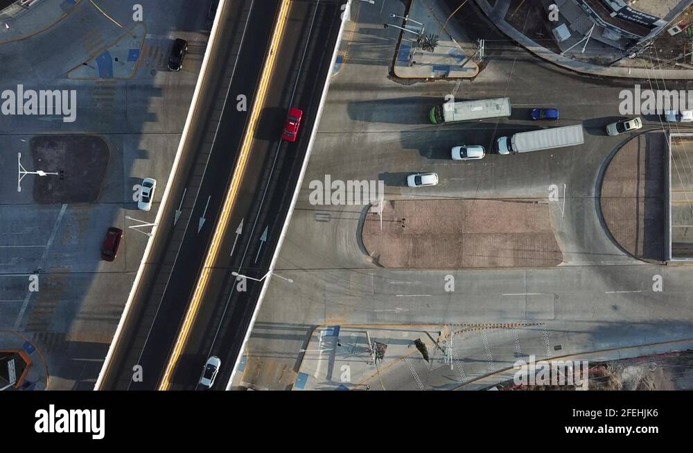 Overhead Aerial of Busy Urban City Road Traffic Under an Overpass ...
