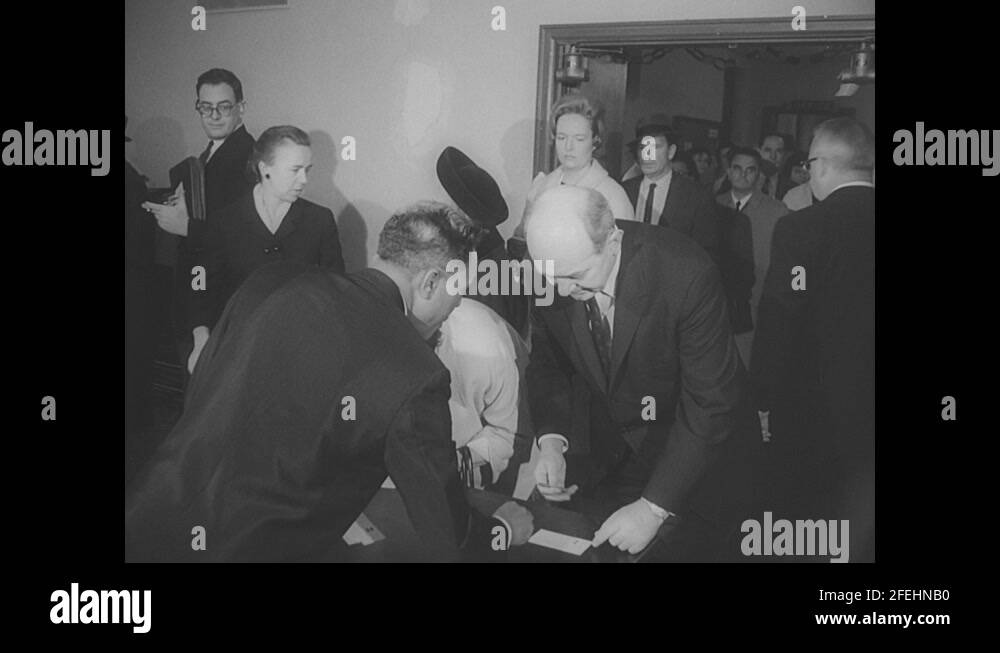 1960s: People wait in line to vote. Polling place. People fill out ...