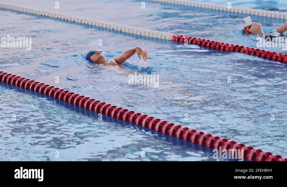 Swimming Lesson - Young Boy Practicing Backstroke In The Swimming Pool ...