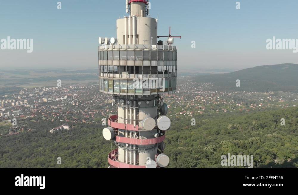 Aerial / drone footage of the Pécs TV Tower. Pécs is the fifth largest ...
