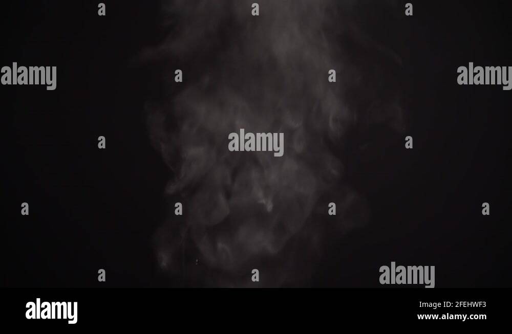 Steam from boiling water.Realistic atmospheric gray smoke with splashes ...