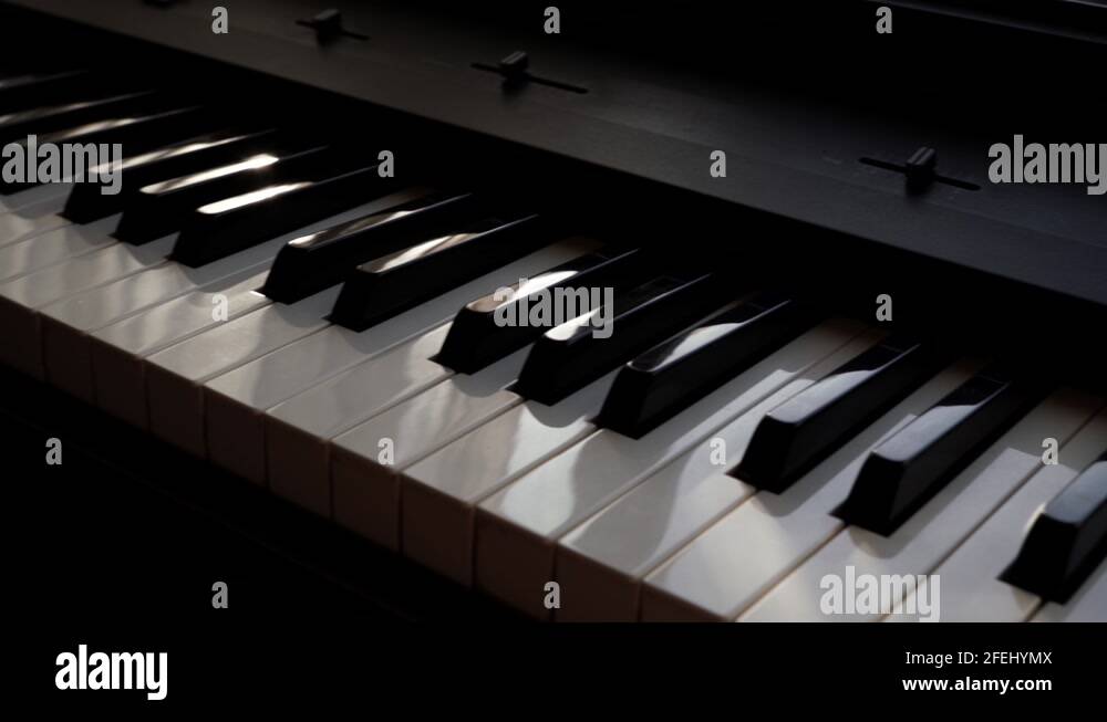 Piano keyboard background. Piano keys side view Stock Video Footage - Alamy
