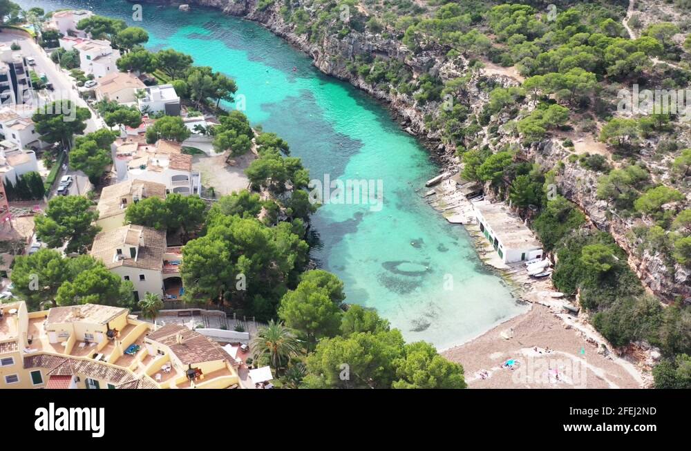 Cala Pi Beach in Mallorca Spain with swimmers and cliff beach homes ...