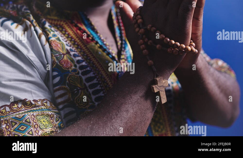 Folded Hands of Religious Black African Male With Rosary and Cross ...