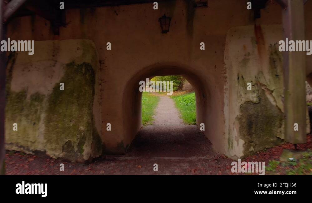 drone passes through the middle of three tunnels located under a bridge ...