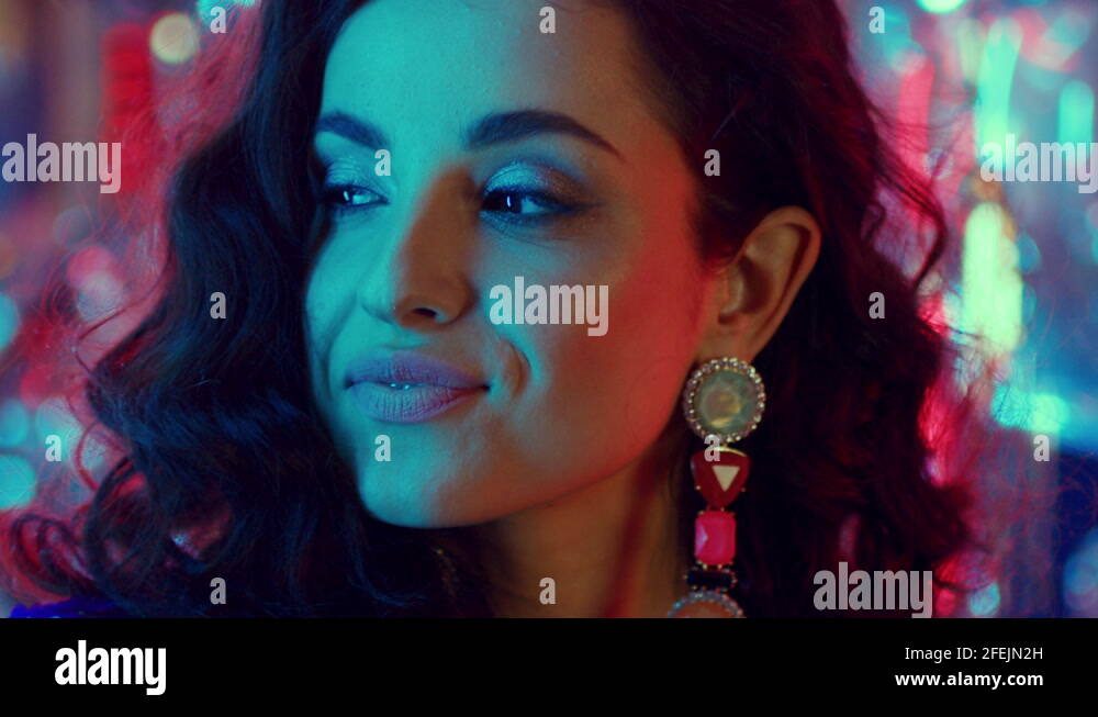 Smiling girl face in nightclub. Female person making facial expression ...