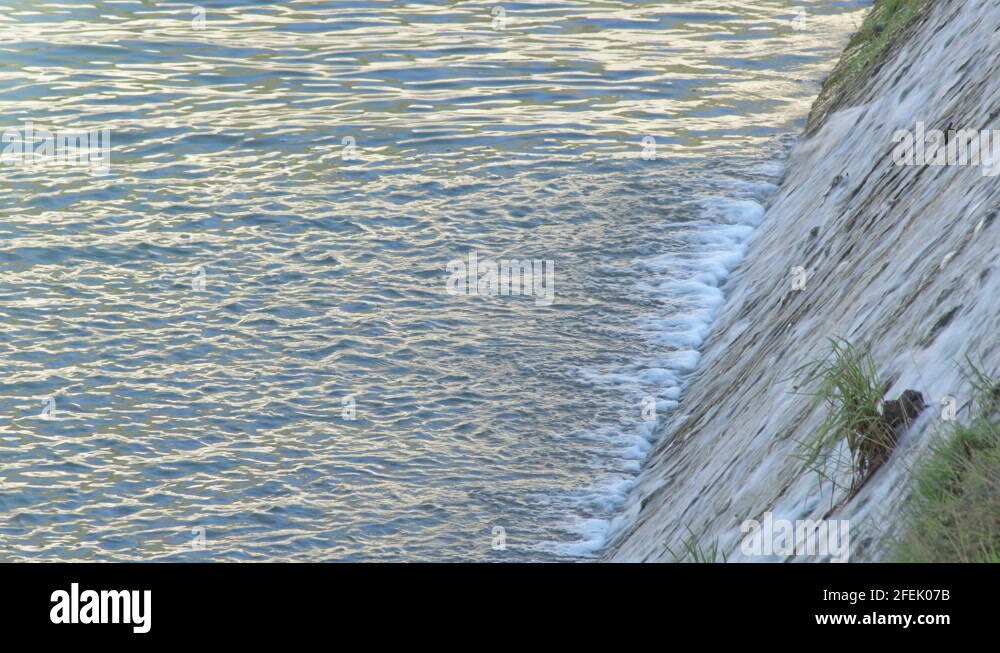 Water torrents falling into a dam in a swamp Stock Video Footage - Alamy