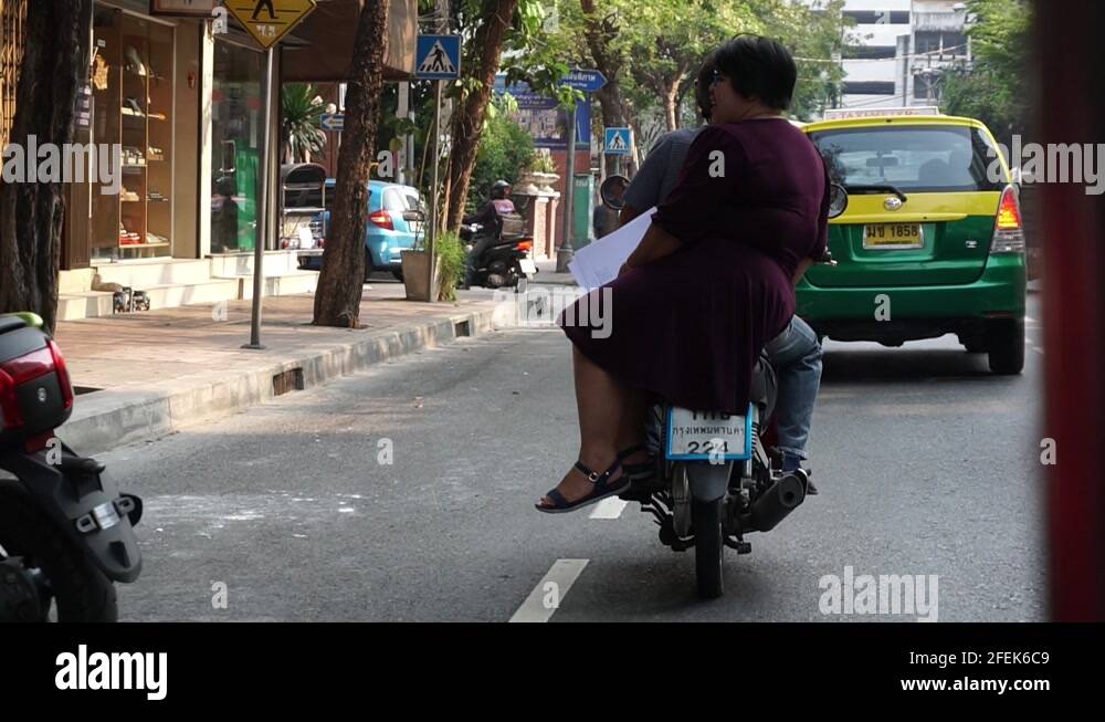 Lady in scooter Stock Videos & Footage - HD and 4K Video Clips - Alamy