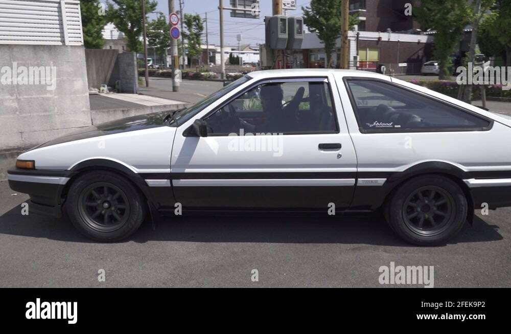 A White Toyota AE86 Hatchback Car Parked in Kyoto Japan Stock Video ...