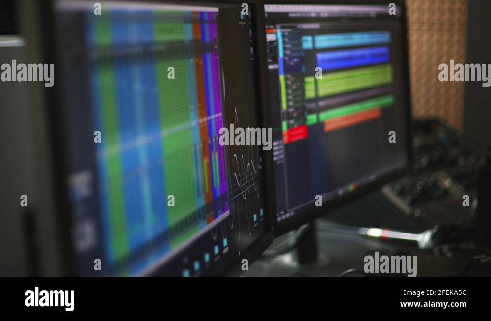 Dual monitor setup at an audio recording studio with a daw with ...