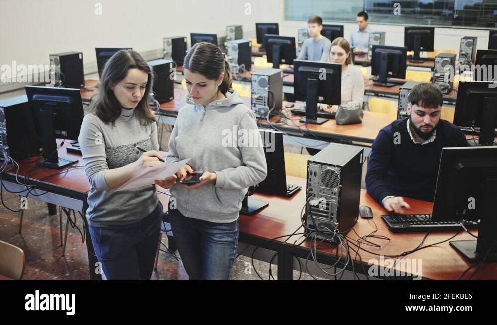 Group Of People Of Different Ages Learning To Use Computers In Classroom Stock Video Footage Alamy