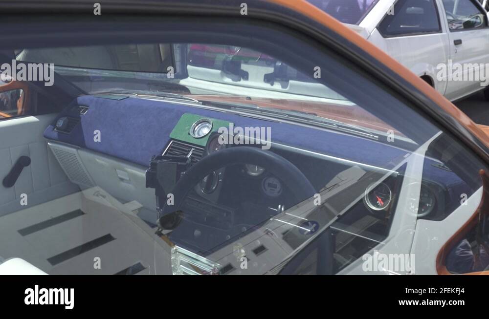 A Moving Shot through the Window of a Modified Orange Toyota AE86 Stock ...