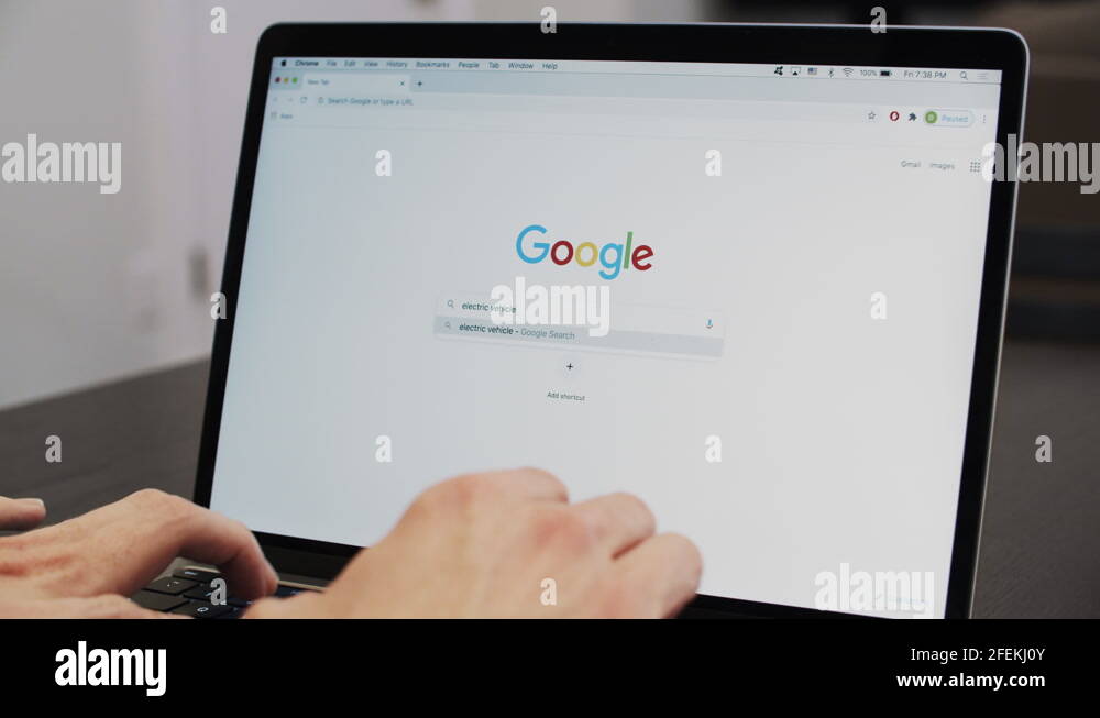 Typing "Electric Vehicles" in Google search Stock Video Footage - Alamy