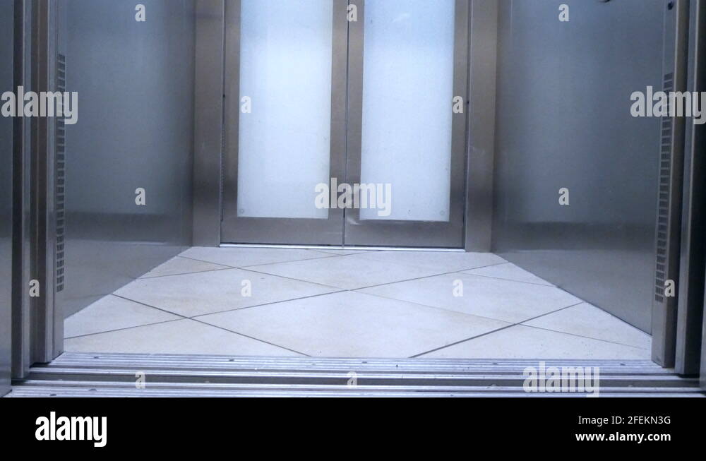 Opening and closing doors in elevator Stock Video Footage - Alamy