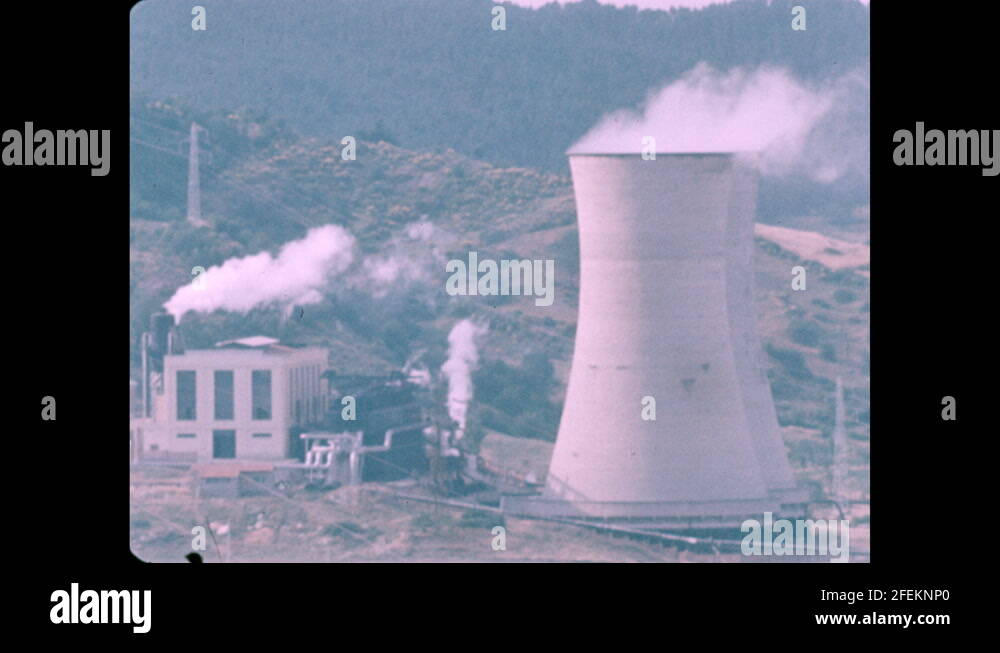 1950s: Smoke rises from nuclear power plant. Nuclear power plant Stock ...