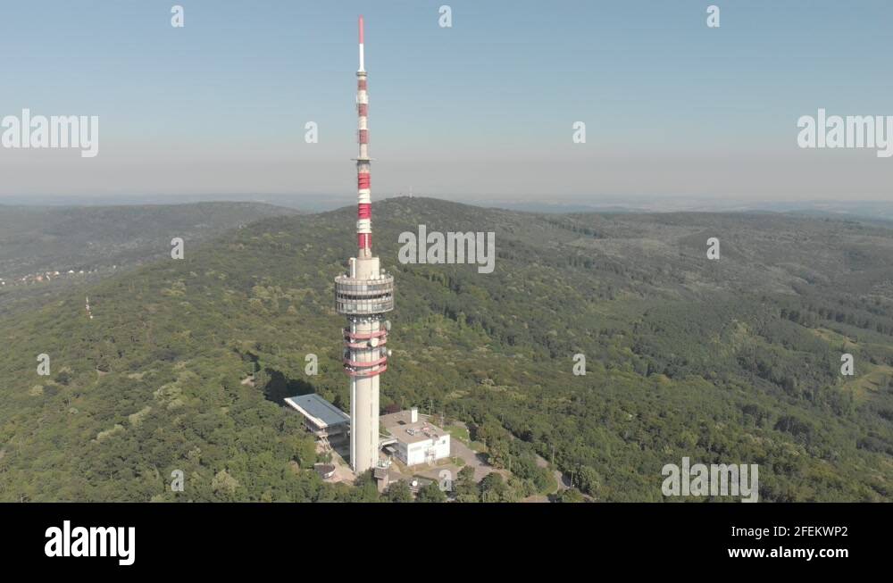 Birdseye orbiting footage of the Pécs TV Tower. Pécs is the fifth ...
