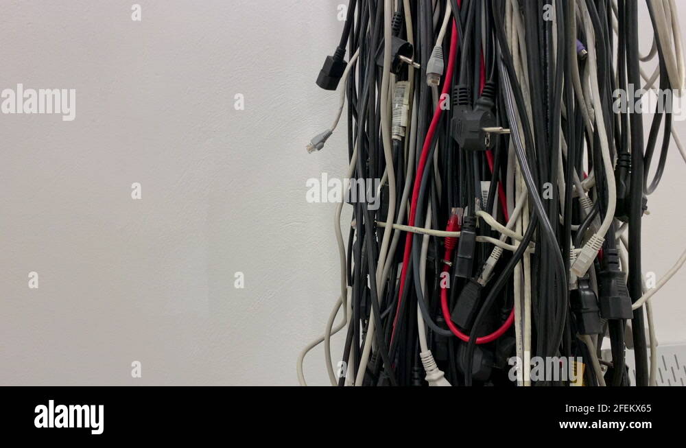 Hanging cable clutter inside server room.Unwanted Electronic Cables ...