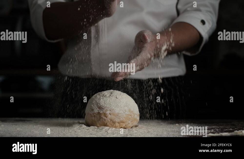 bakery chef clapping flour making bread dough. Baking concept Stock ...