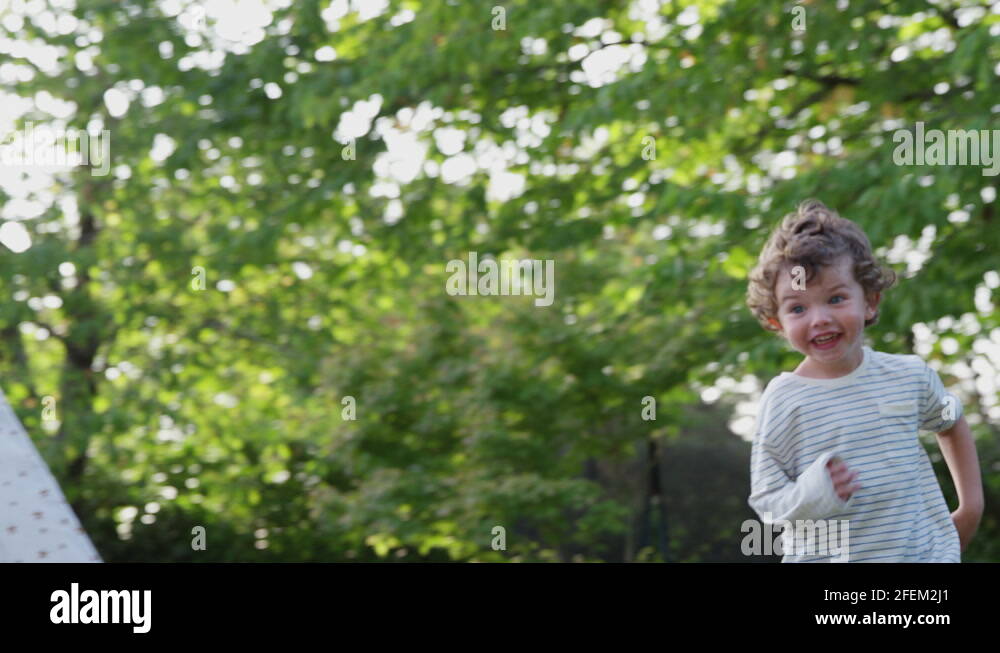 Father With Son Having Fun In Garden Running Around Tent Together Stock ...