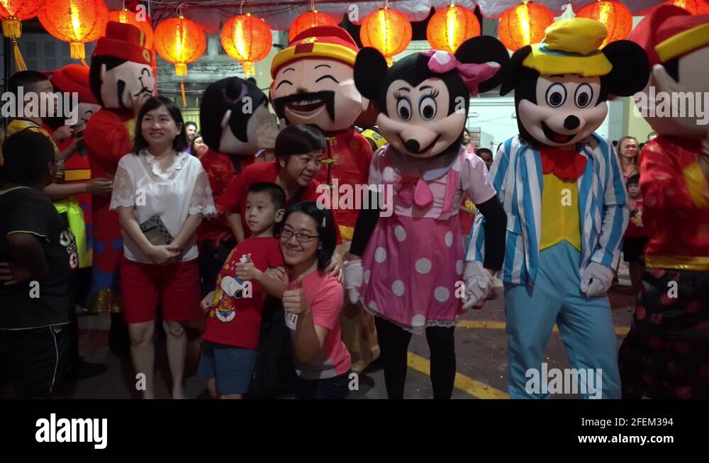 Crowd take photo with mascot of mouse and god of wealth Stock Video ...
