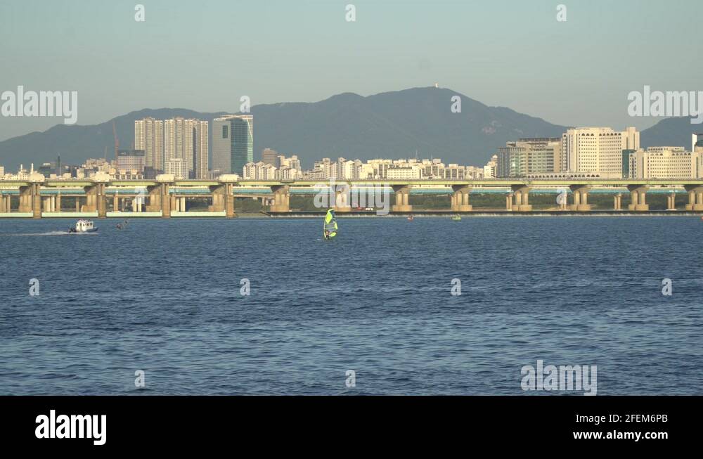 Jamsil Bridge, windsurfer on Han river Seoul, South Korea daytime wide ...