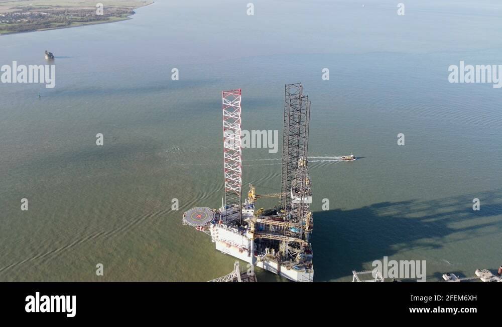 Oil rig moored at Sheerness overhead drone Point of view Stock Video ...