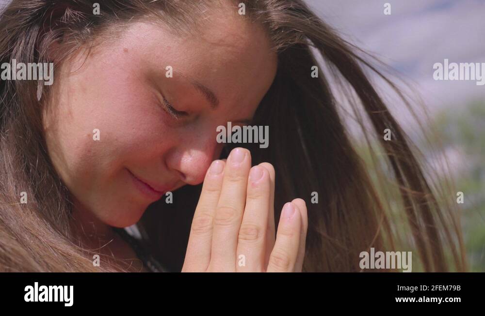 Lovely Woman Concentrating in yoga sun salutation, namaste in forest ...
