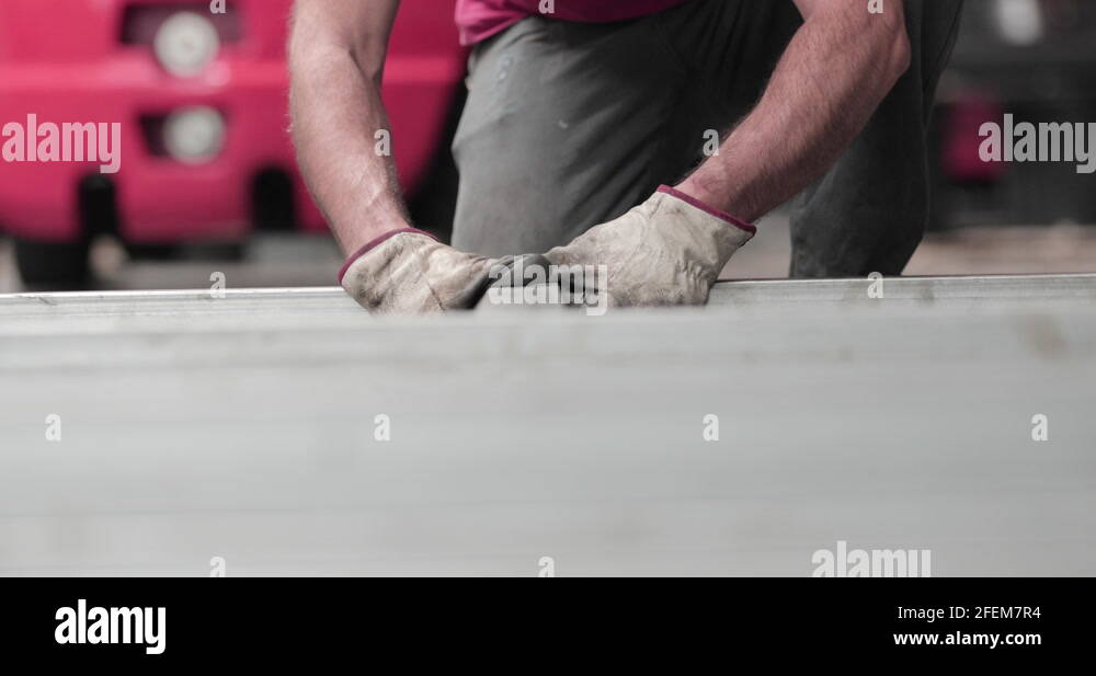 Steelworker Measuring Alignment Of Stud Of A Metal Frame - selective ...
