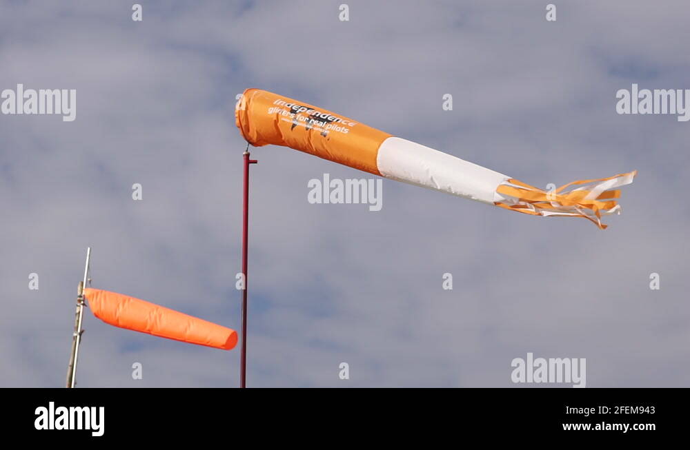 Airfield sign of the direction and force of the wind against cloudy ...
