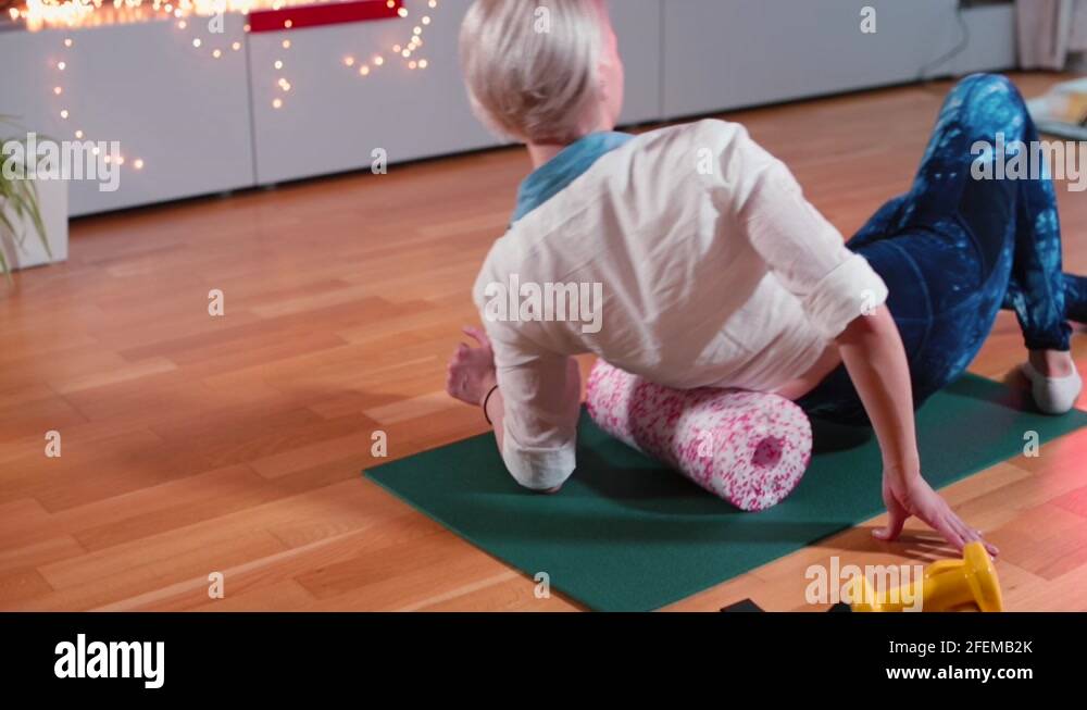 Massage the broad back muscle using a gymnastic roller human spinal ...