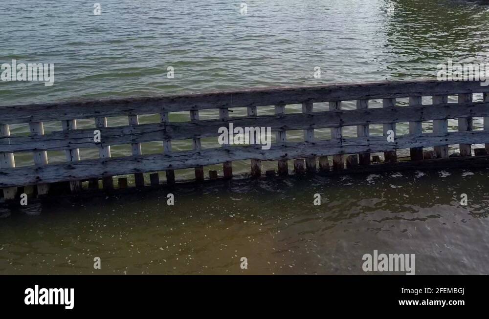 Slow low rotate inside of large wooden skeleton hull of boat wreck ...