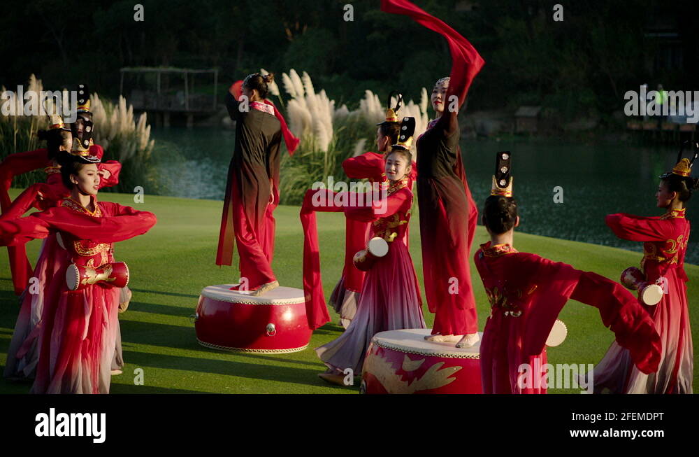 Slow motion Chinese female dancers performance with drums and ribbons ...