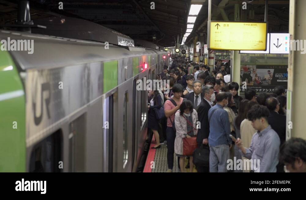 Rush Hour in Tokyo Metro. Full Of People. Waiting For the Train Stock ...
