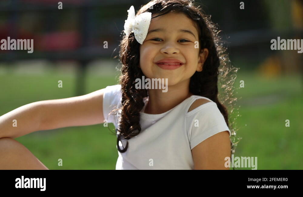 Cute happy hispanic mixed race little girl child outside Stock Video ...