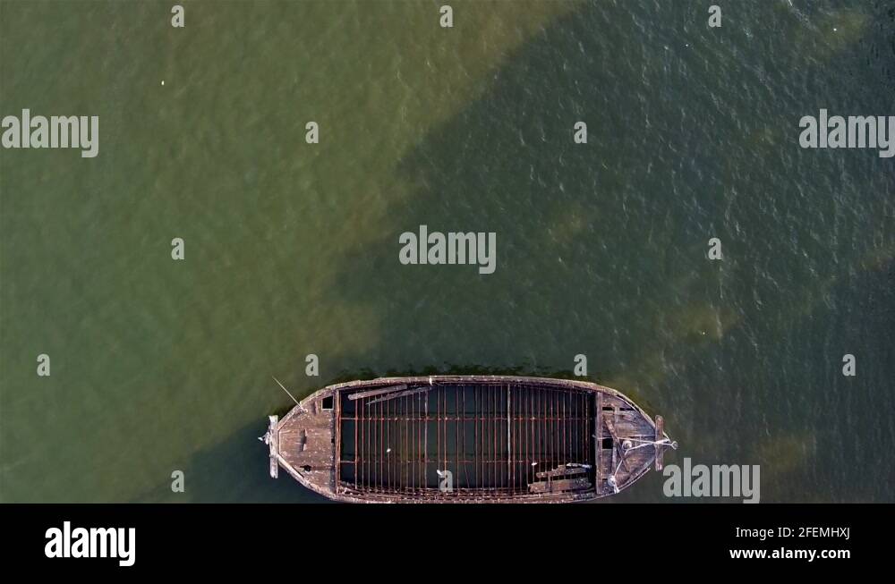 High fly over two large abandoned Thai wooden skeleton ship hulls Stock ...
