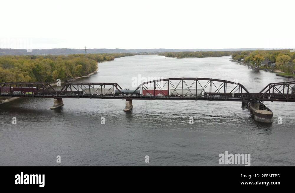 Train crossing the railroad swing bridge over the Mississippi River in ...