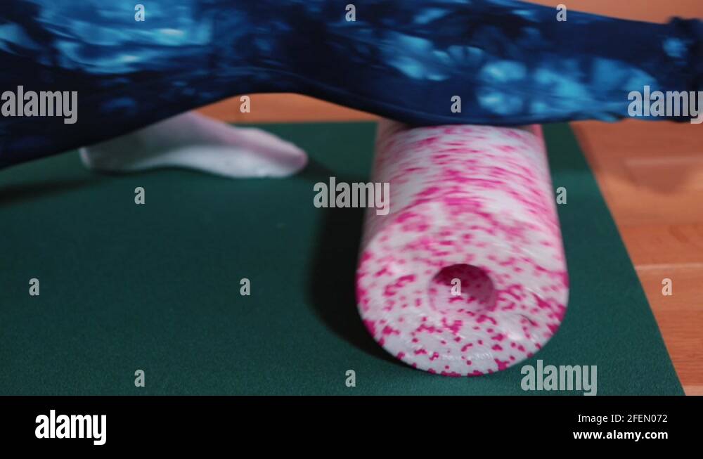 use gymnastic roller in sports training. Massage leg muscles after ...