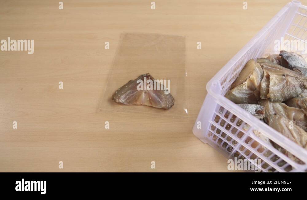 Close up Footage Of Fish Packing into The Plastic Bag on Packaging ...