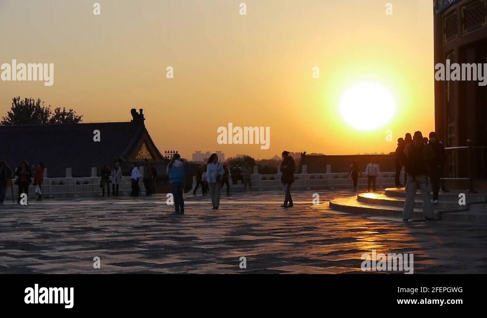 Tourists & China's ancient architecture in sunset.Temple of Heaven in ...
