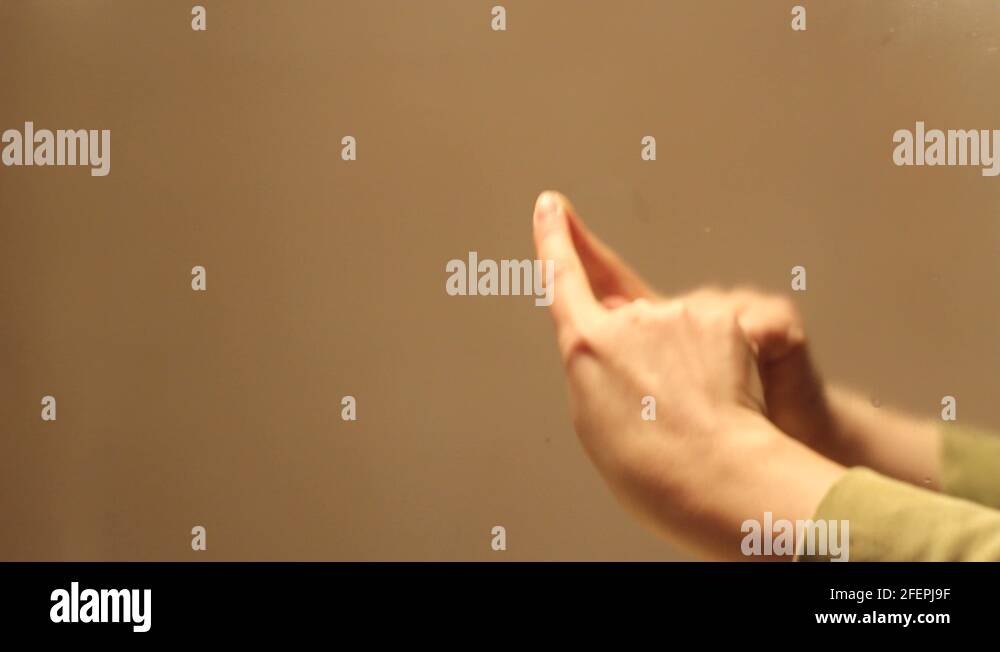 Lady finger drawing a heart on mirror the covered with steam Stock ...