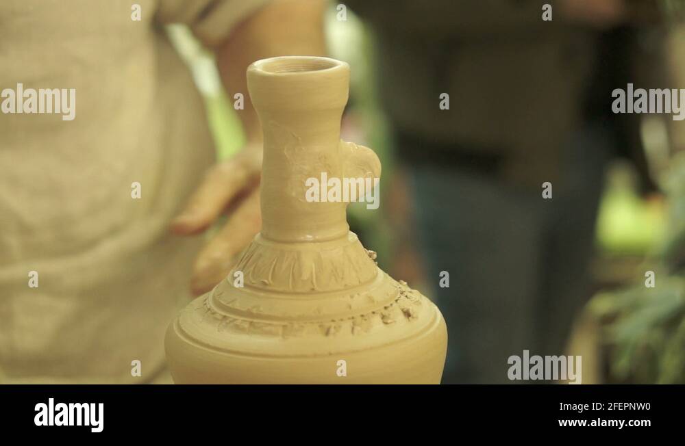 Potter works. Crockery creation process in pottery on potters' wheel ...