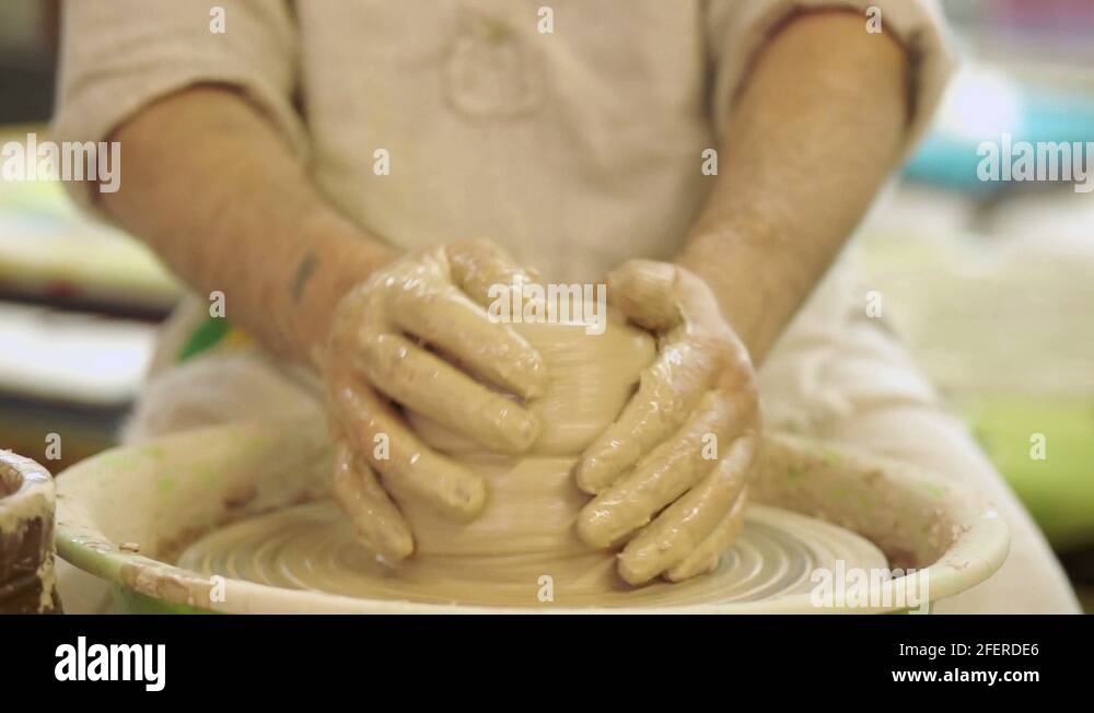 Potter works. Crockery creation process in pottery on potters' wheel ...