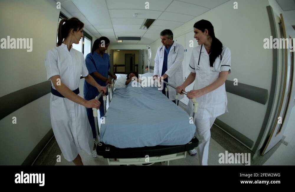 Hospital Staff Pushing Bed Young Patient Medical Facility Stock Video ...