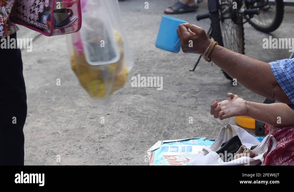 Begging for money Stock Videos & Footage - HD and 4K Video Clips - Alamy