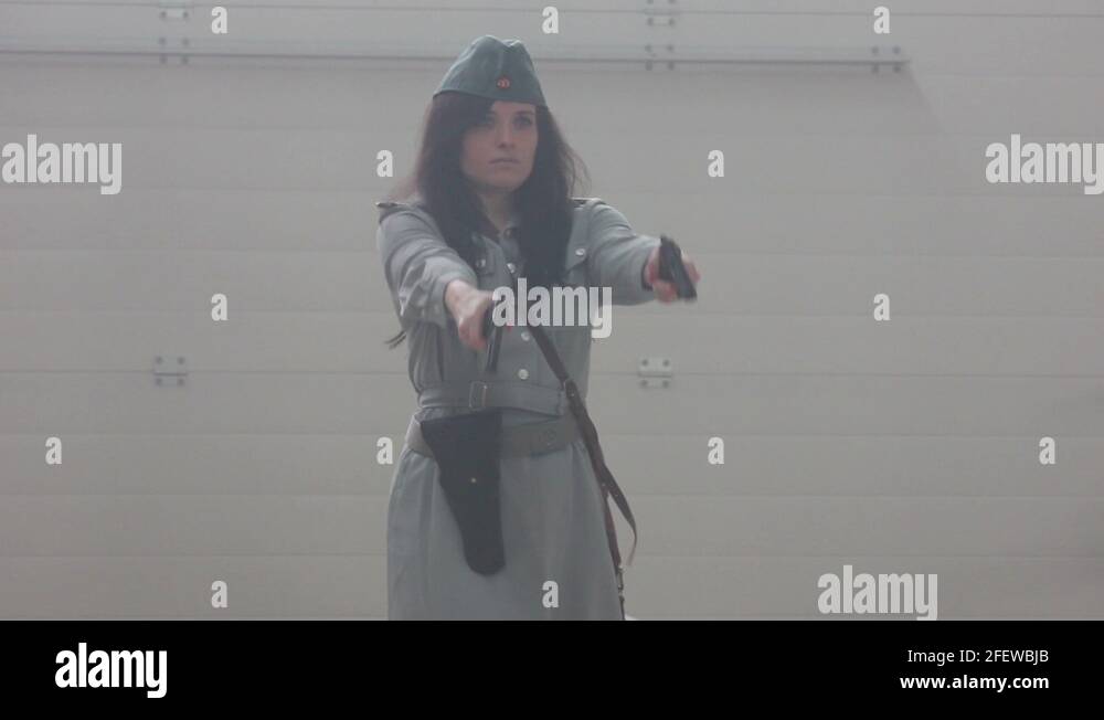 Female Officer Shooting Two Pistols Stock Video Footage - Alamy