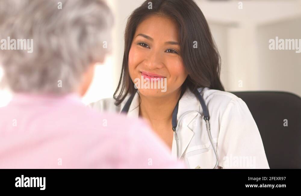 Japanese doctor enjoying a conversation with her patient Stock Video ...