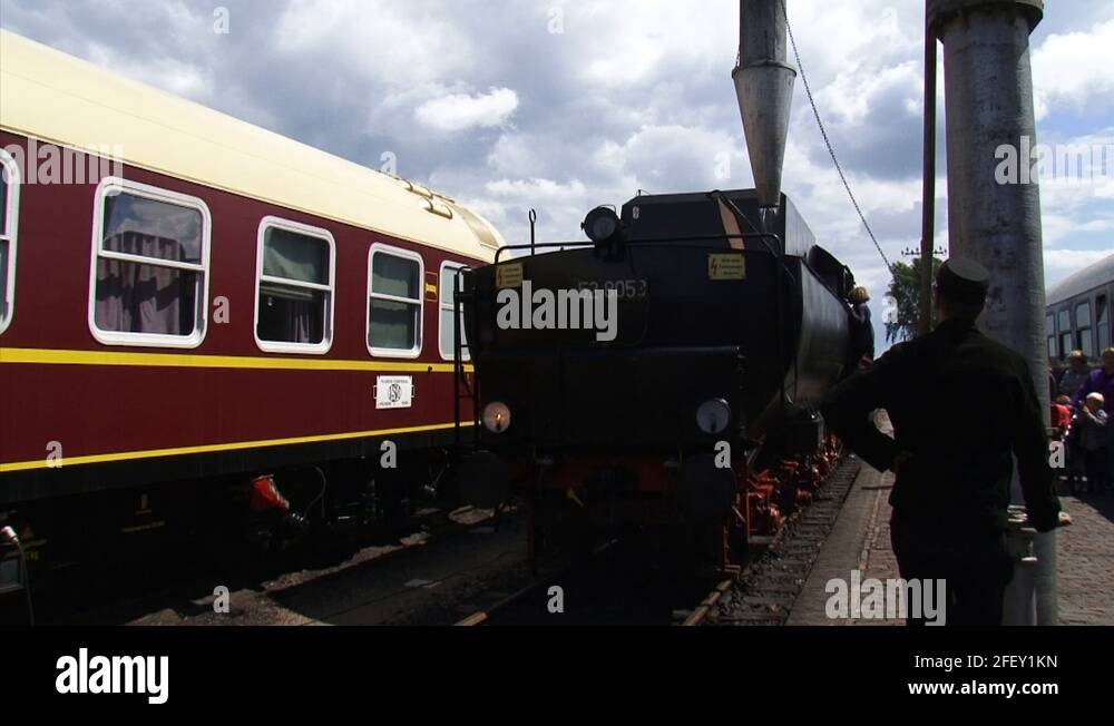 Loading steam locomotive with water at railway station Stock Video ...