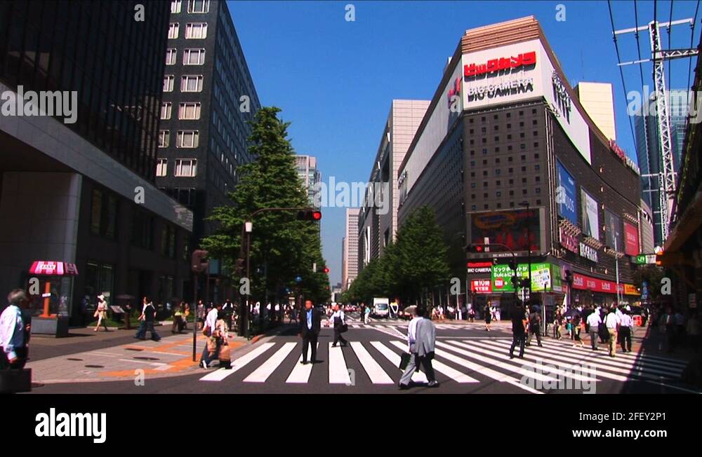 Tokyo, Japan - Pedestrian at intersection in Hibiya district -Timelapse ...